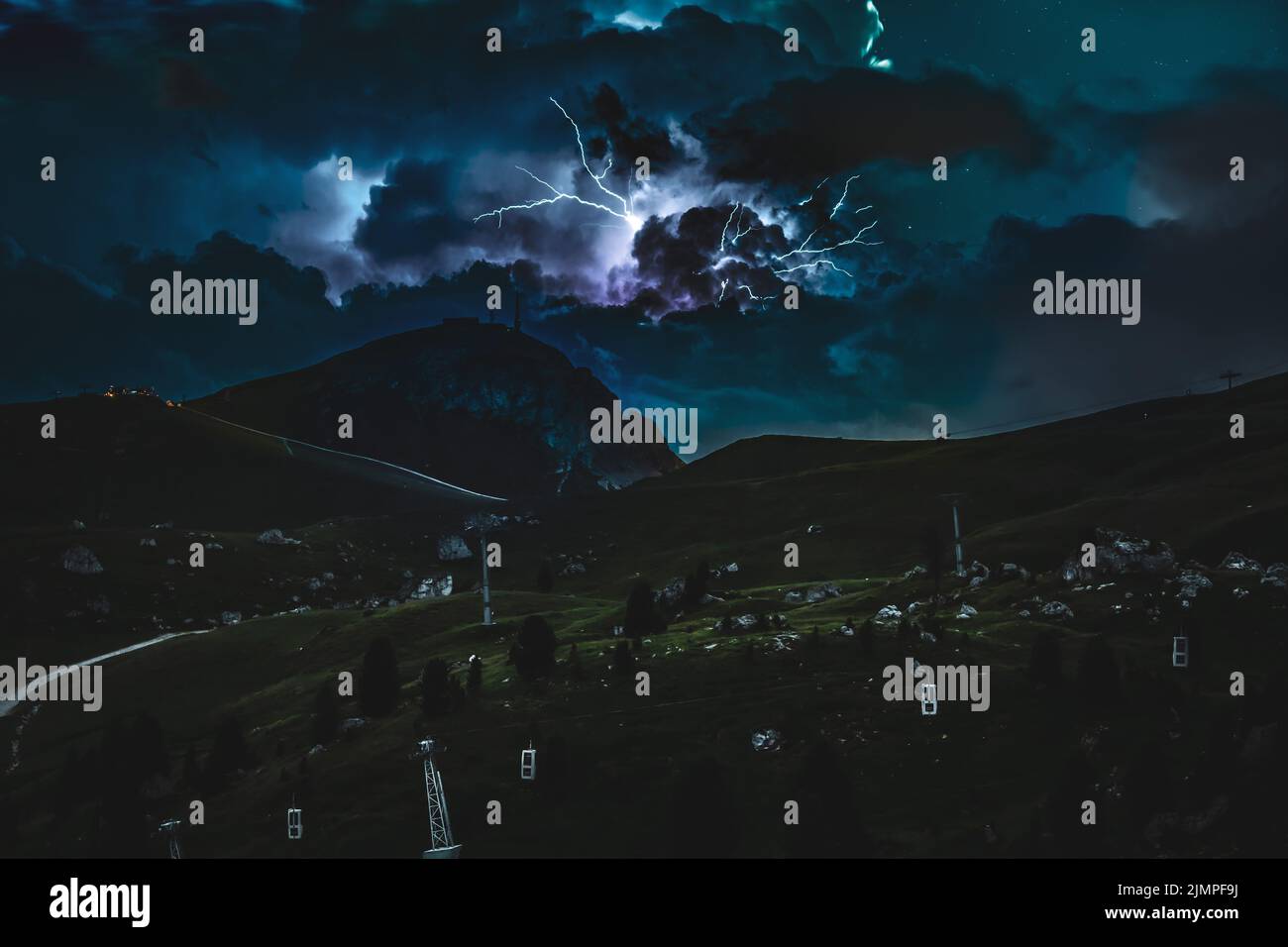 Huge lightning bolt during nightly thunderstorm in the Dolomites. Italy ...