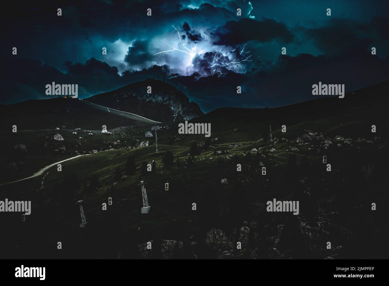 Huge lightning bolt during nightly thunderstorm in the Dolomites. Italy ...