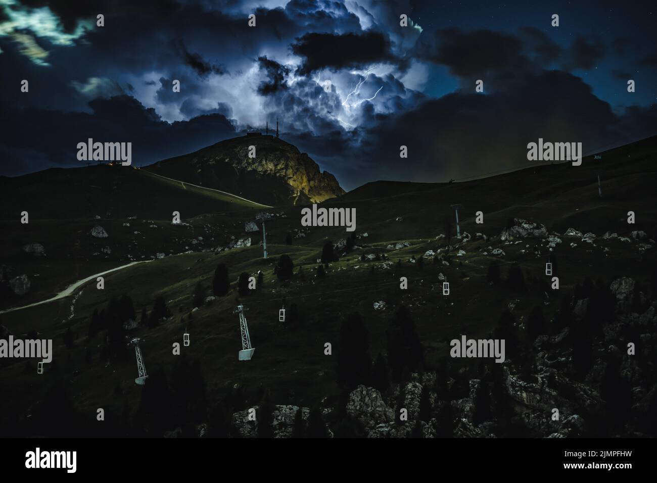 Huge lightning bolt during nightly thunderstorm in the Dolomites. Italy ...