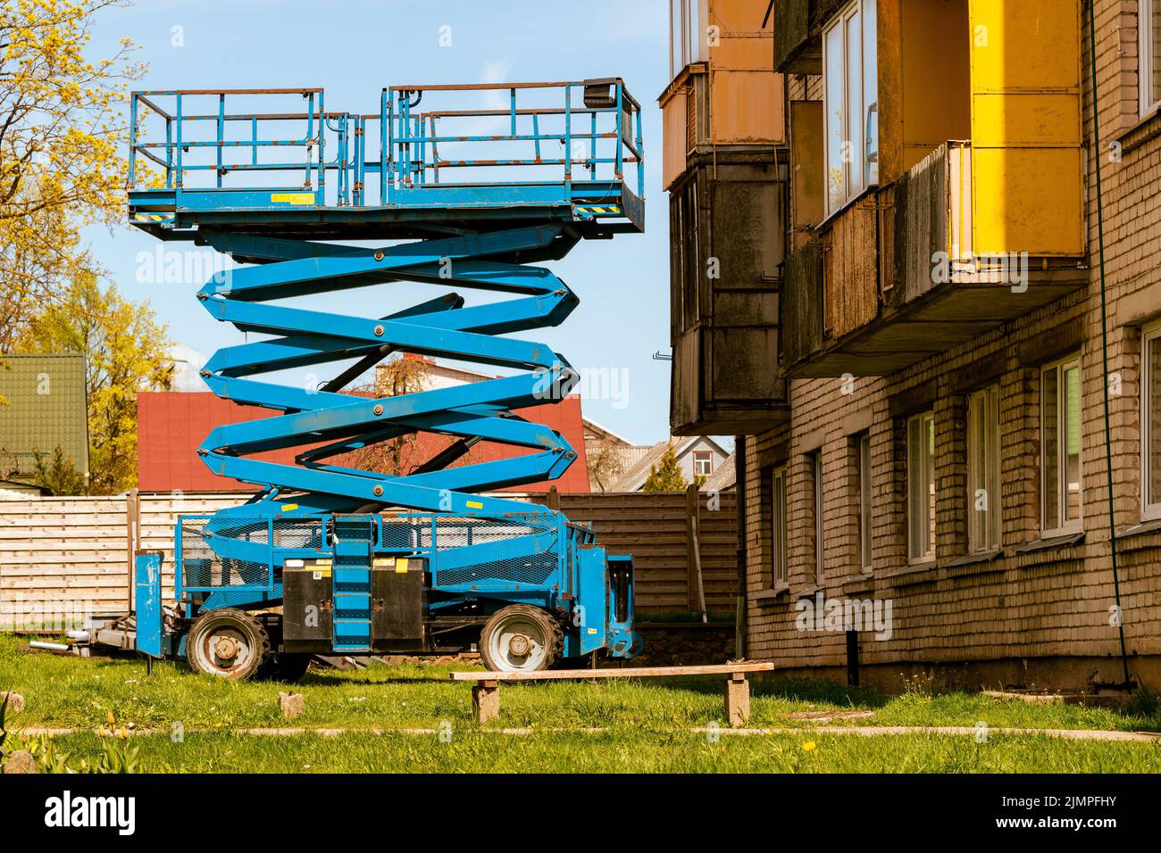 Scissor lift platform for the renovation of the house facade Stock ...