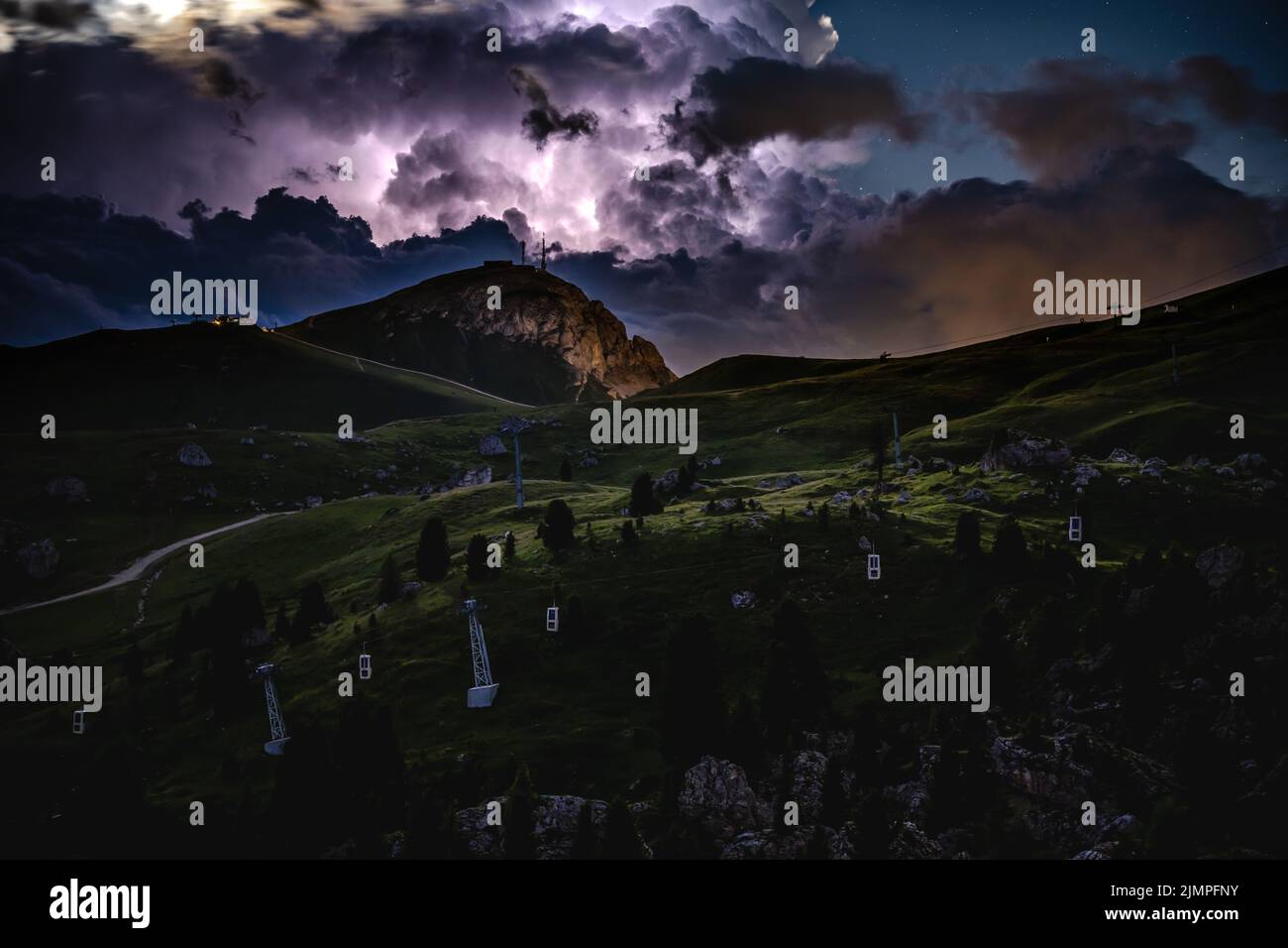 Huge lightning bolt during nightly thunderstorm in the Dolomites. Italy ...