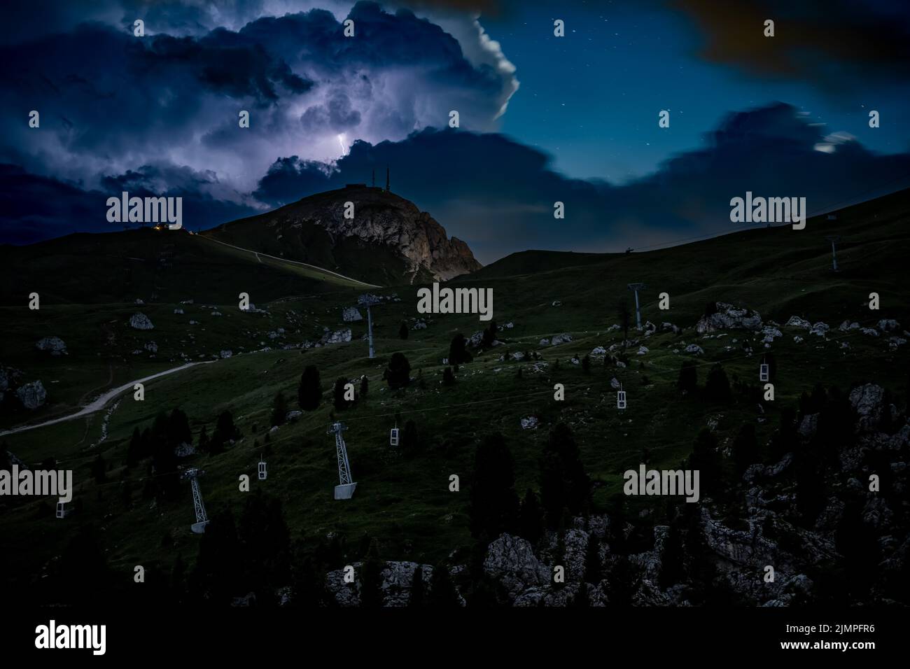 Lightning bolt during nightly thunderstorm in the Dolomites. Italy ...