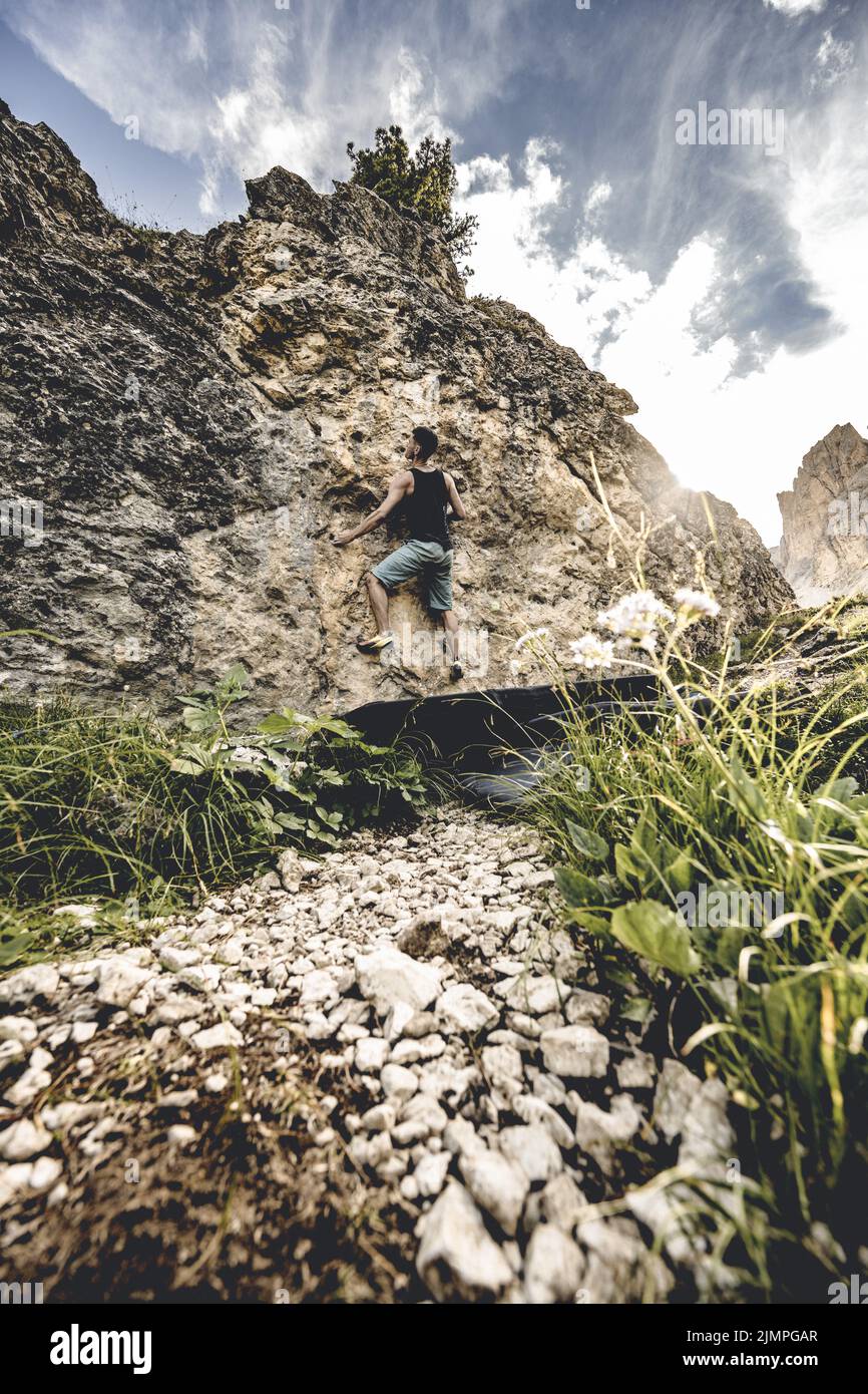 Man bouldering in Steiner town near Sella Pass Stock Photo - Alamy