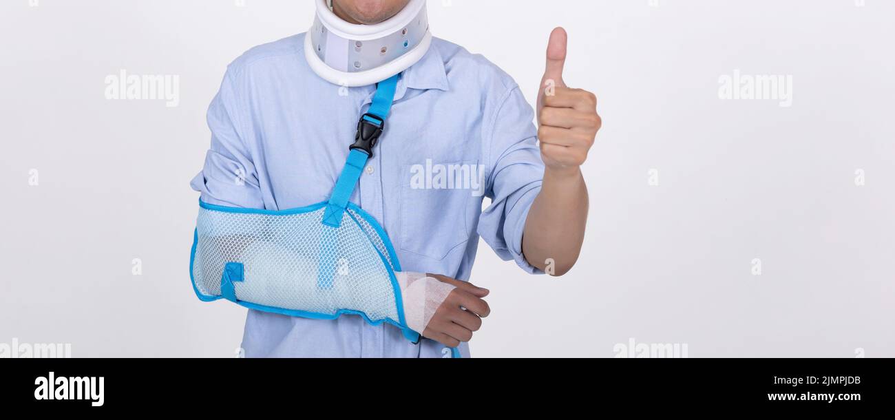 Portrait of Asian man with broken arm and neck feeling showing thumbs ...