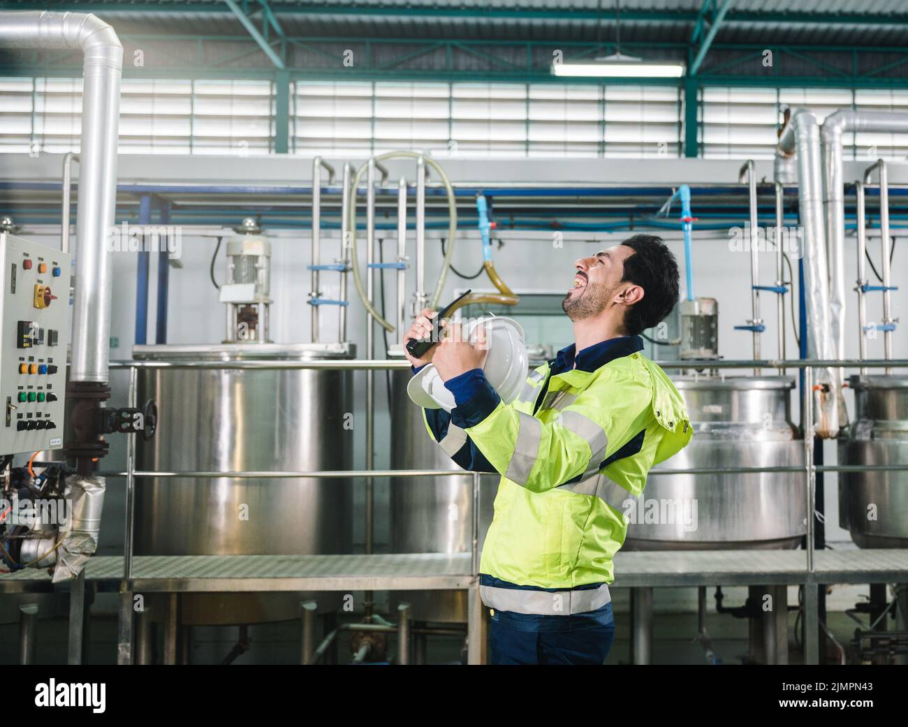 Happy successful of caucasian technician engineer man in safety uniform ...