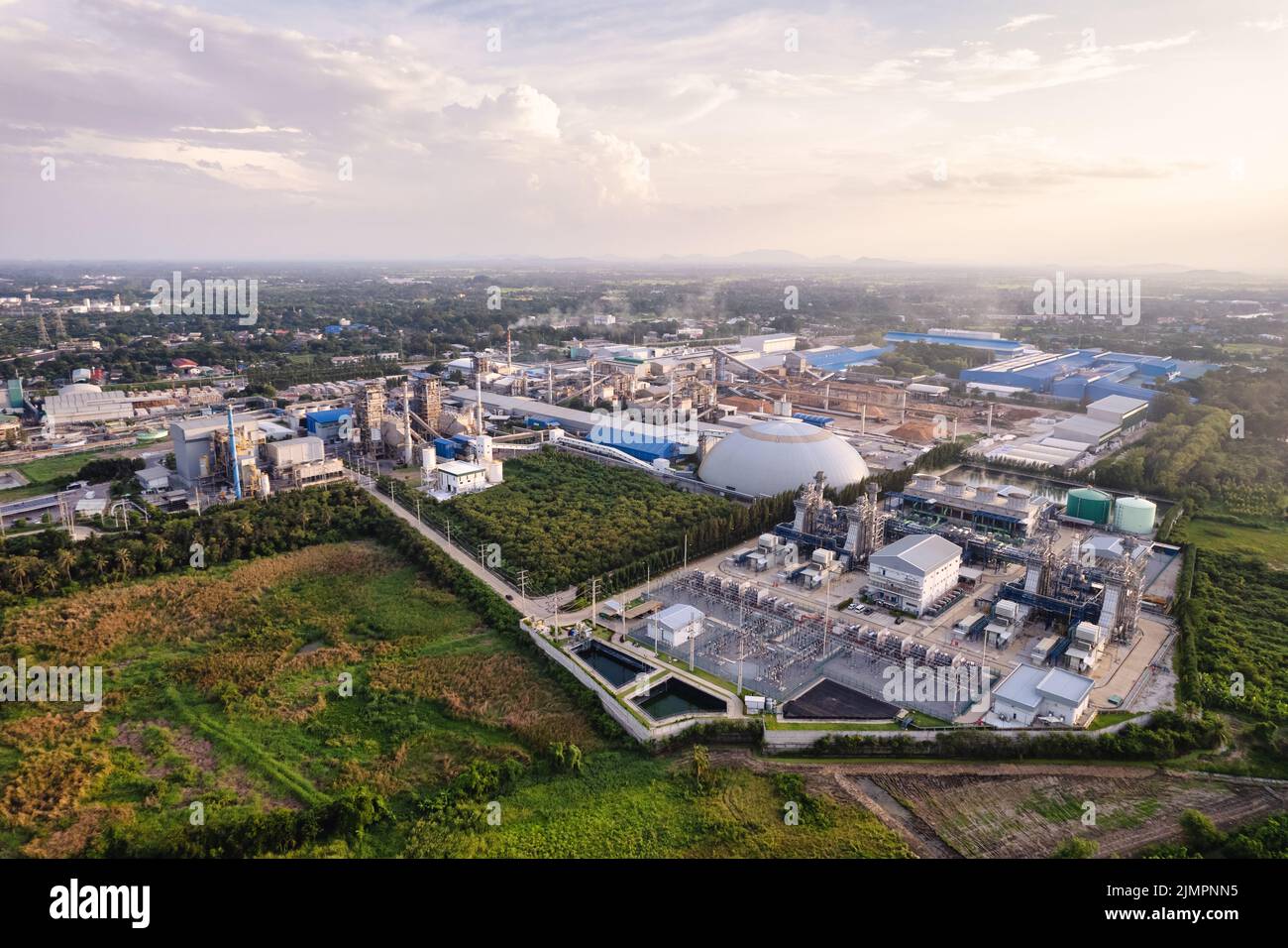 Aerial view of large green energy processing plant with building ...