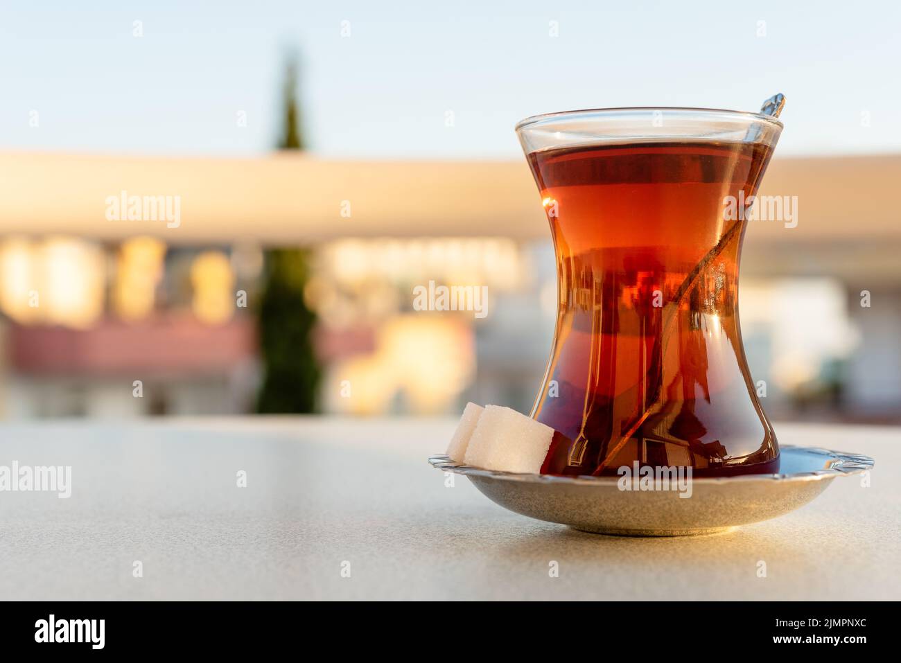 Traditional Turkish tea in a glass glass with a saucer Stock Photo - Alamy