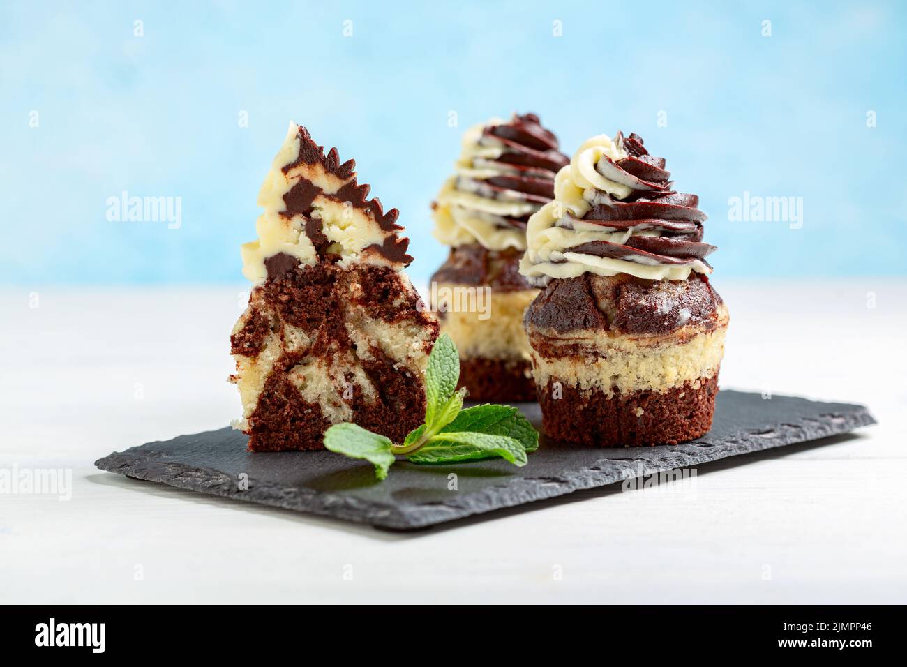 Homemade chocolate and vanilla cupcakes Stock Photo - Alamy