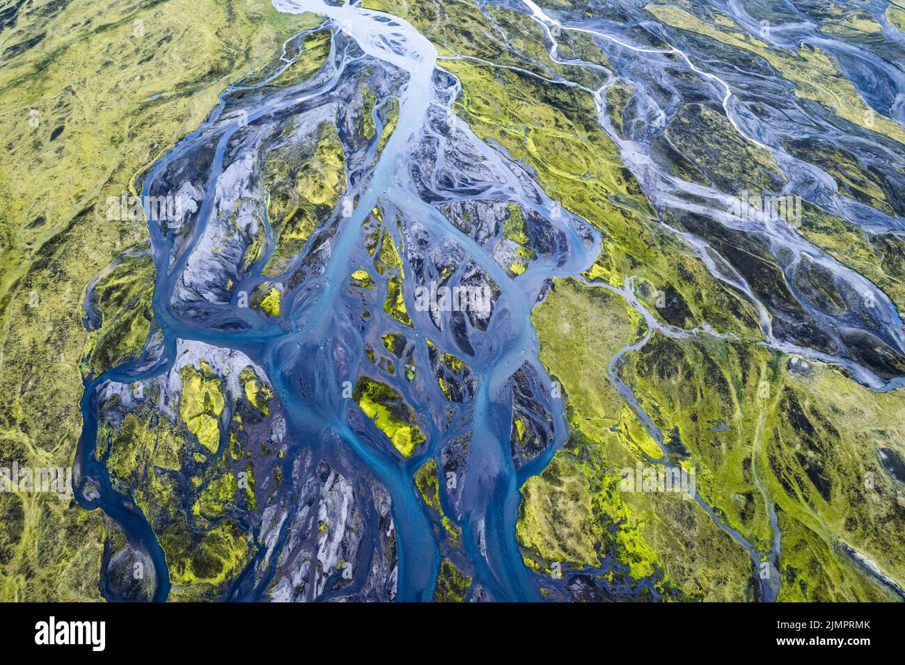 Top view of abstract blue glacier rivers pattern flowing through ...