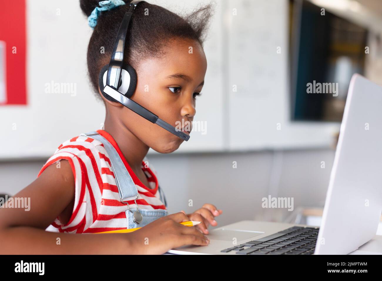 School kid using headphone classroom hi-res stock photography and ...