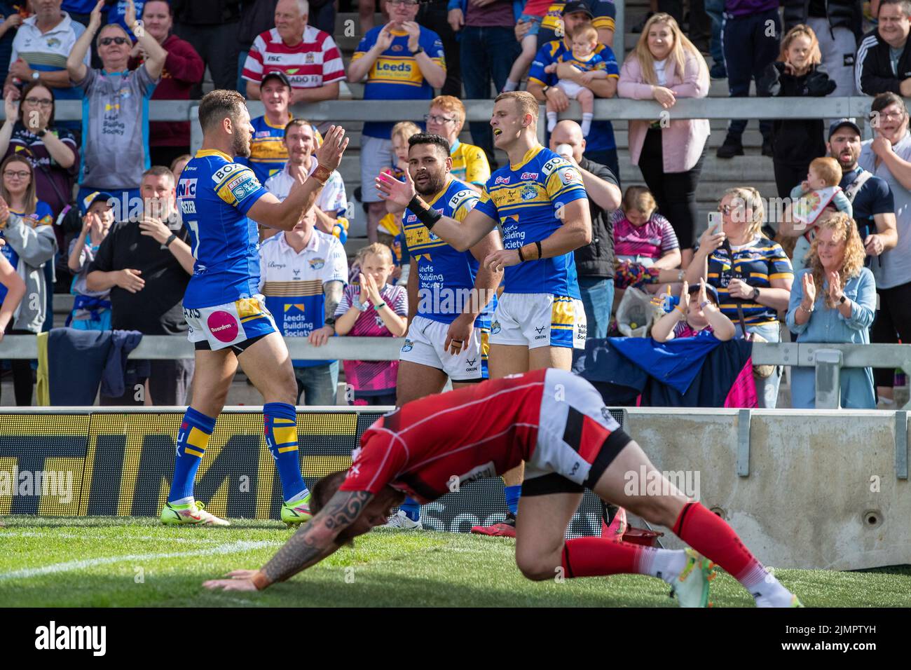 Ash Handley #5 of Leeds Rhinos celebrates his try and makes the score ...