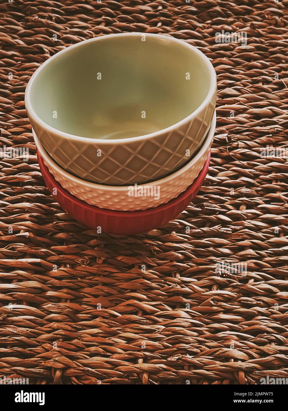 Small empty ceramic measure bowls on rustic wicker background, food ...