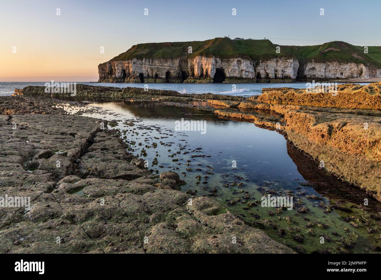 Chalk cliffs and sea caves at Thornwick Bay on the East Yorkshire Coast ...