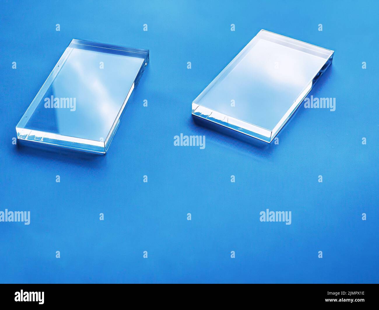 Glass device on blue background, future technology and abstract screen ...