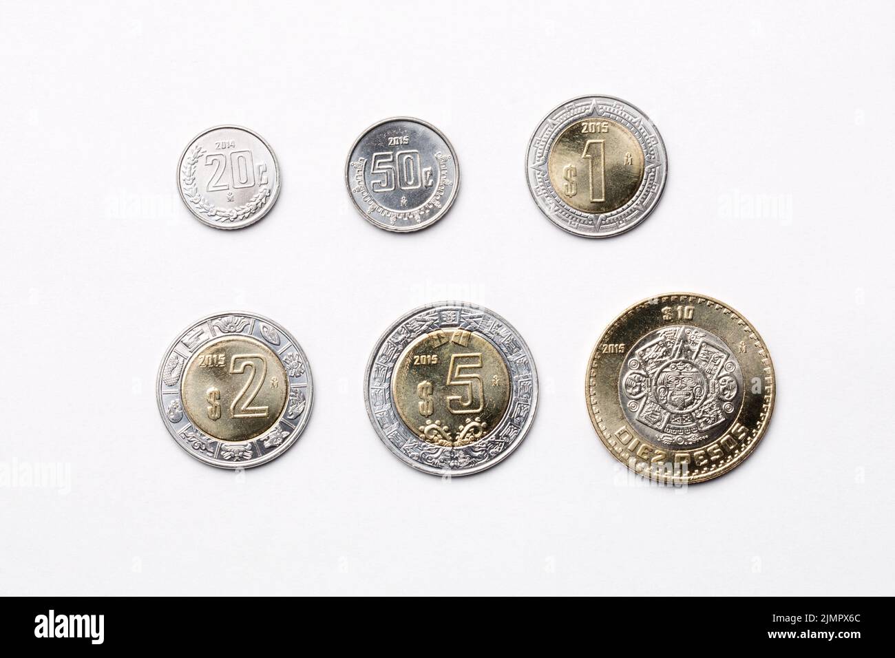 Mexican coins on a white background - Peso Stock Photo - Alamy