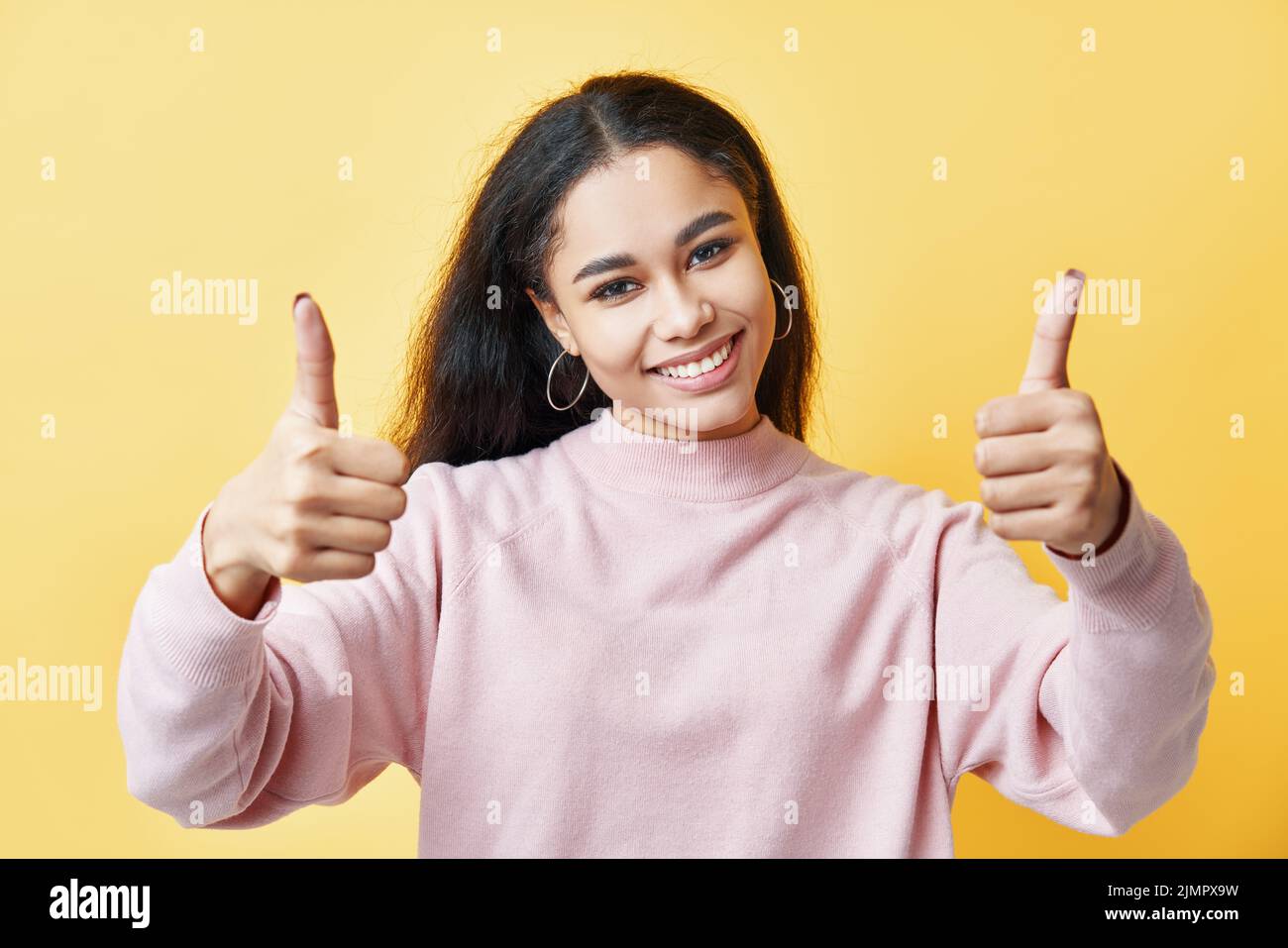 Young woman showing thumb hi-res stock photography and images - Alamy