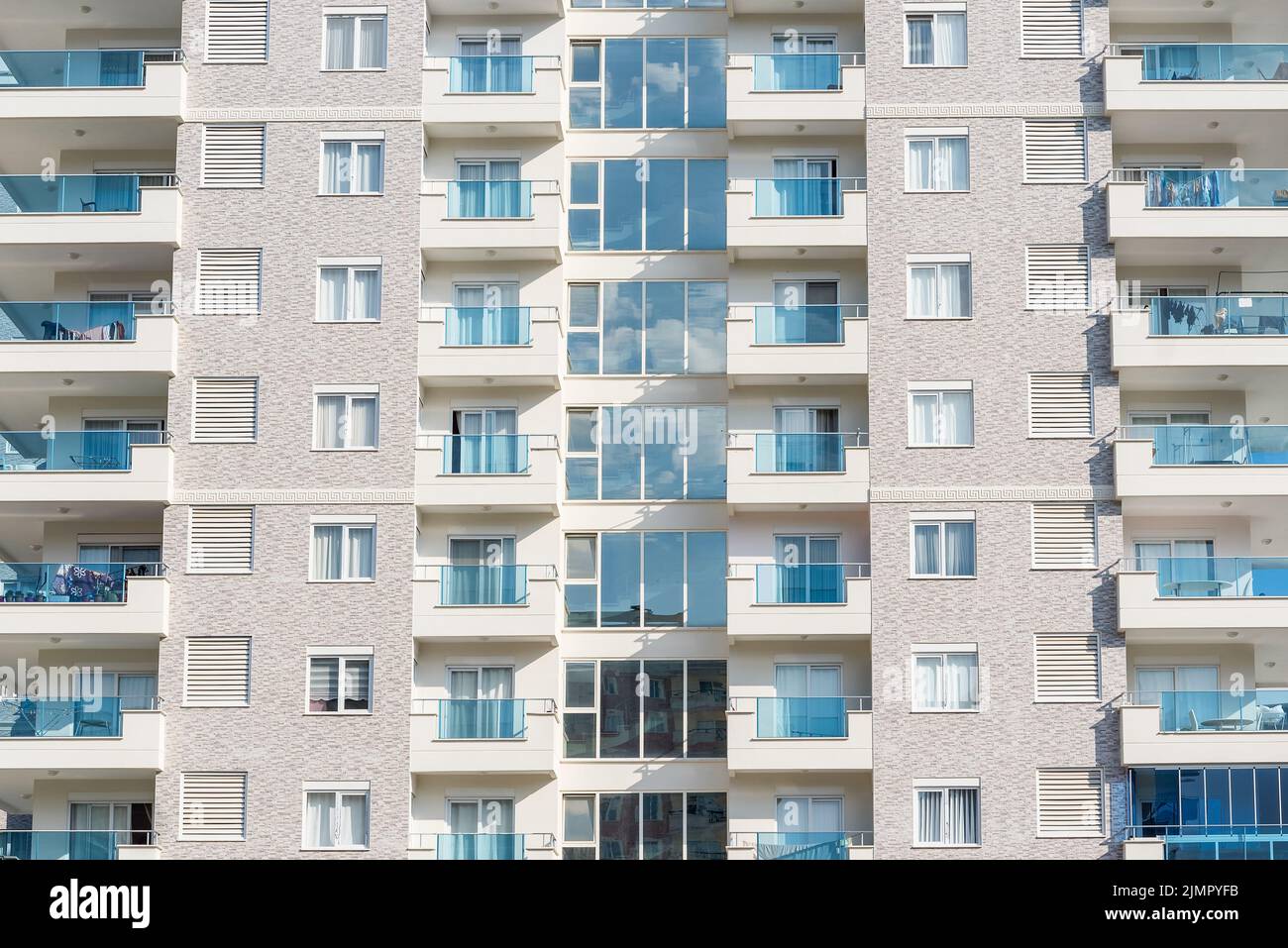 Front view of the windows of a residential apartment building. Facade ...