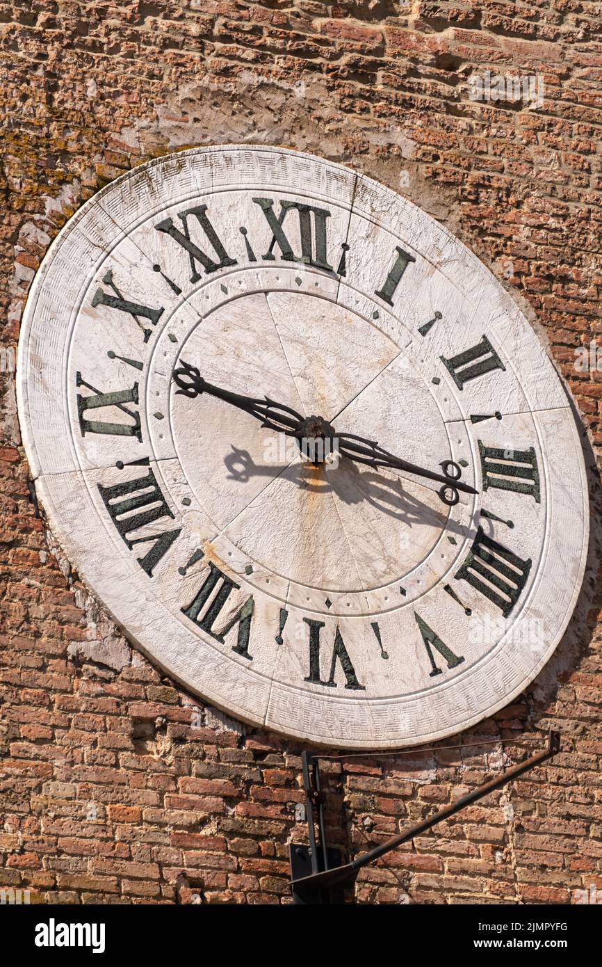 Clock on a wall in siena hi-res stock photography and images - Alamy