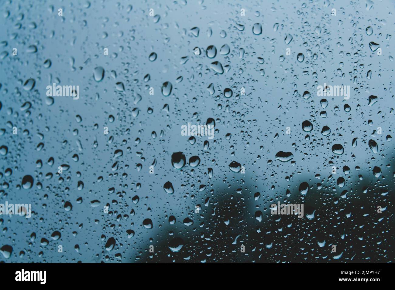 Sun after rain. Drops on glass. It's been raining. Texture on glass ...