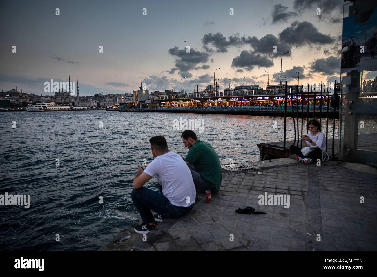 Istanbul, Turkey. 06th Aug, 2022. People seen sitting on the Karaköy ...