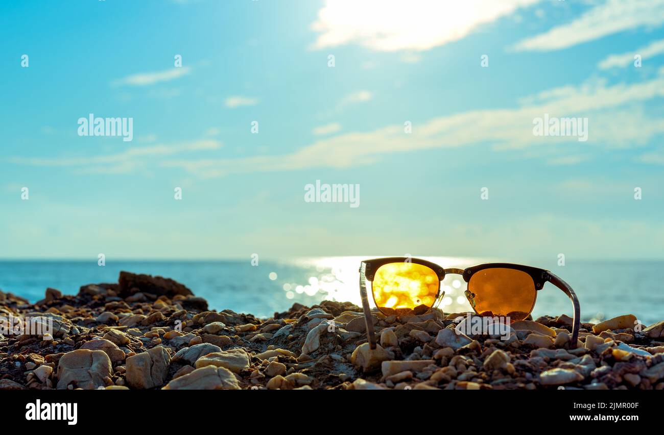Sunglasses lie on rocks hi-res stock photography and images - Alamy