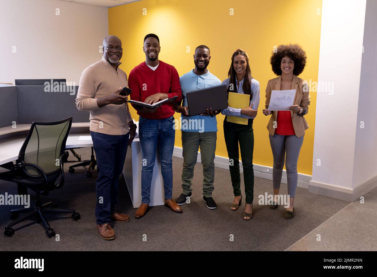 Full length portrait of happy multiracial male and female advisors in ...