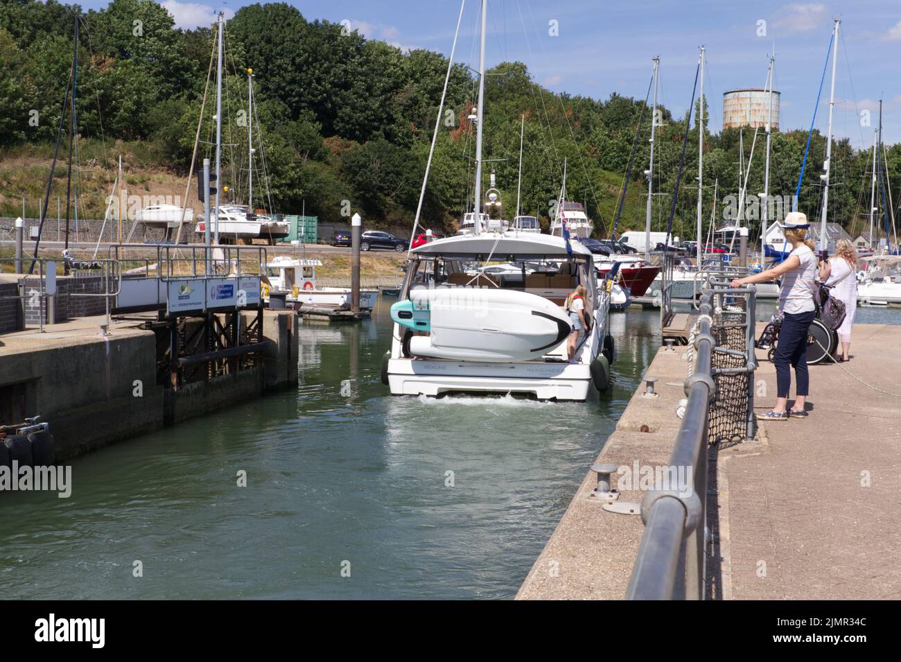 Shotley marina on a summers day in Suffolk with a boat entering the ...