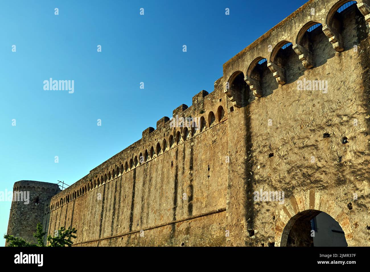 Medieval fortified tower and stone wallsin Tuscany, Italy Stock Photo ...