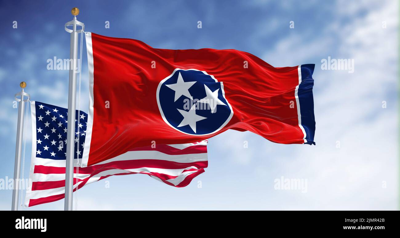 The Tennessee state flag waving along with the national flag of the ...