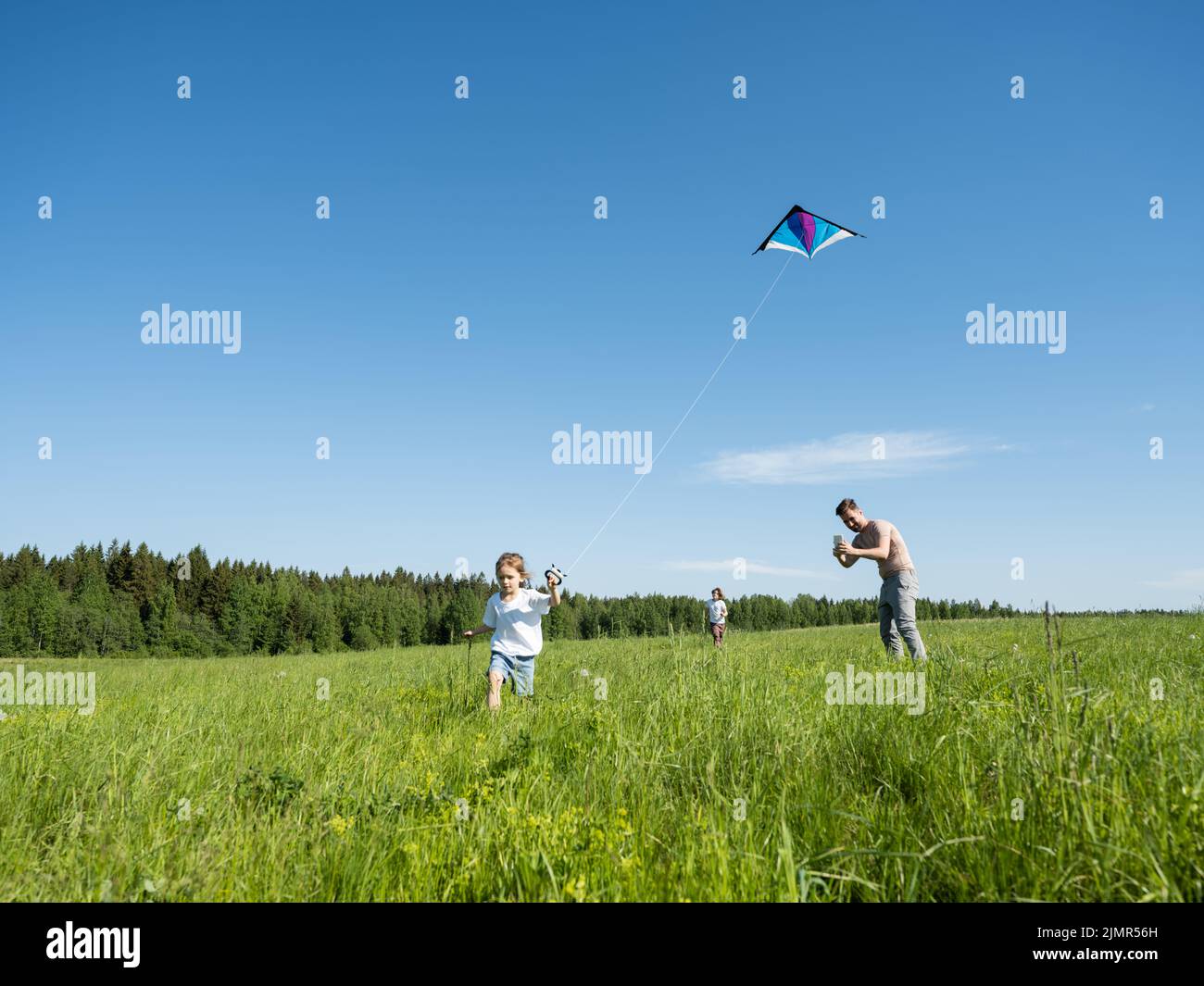 Children running through field hi-res stock photography and images - Alamy