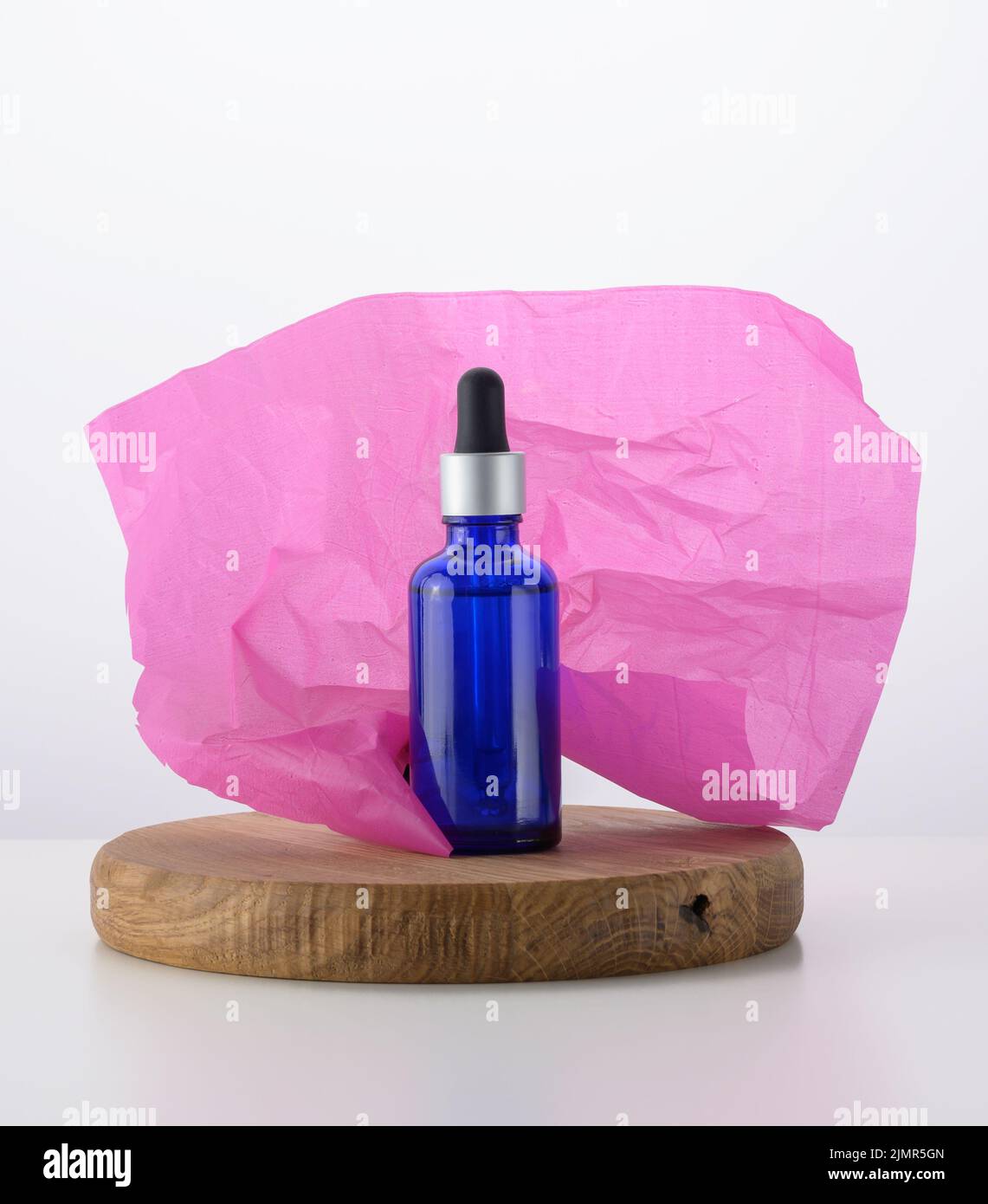 Blue glass bottle with pipette for cosmetics, oils and serum ...