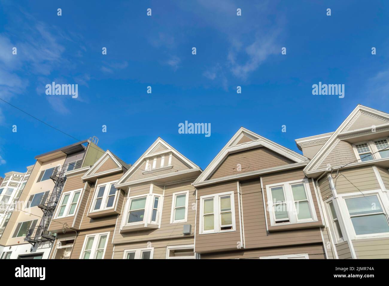 Sloped suburban houses with beige and light brown exterior in San ...