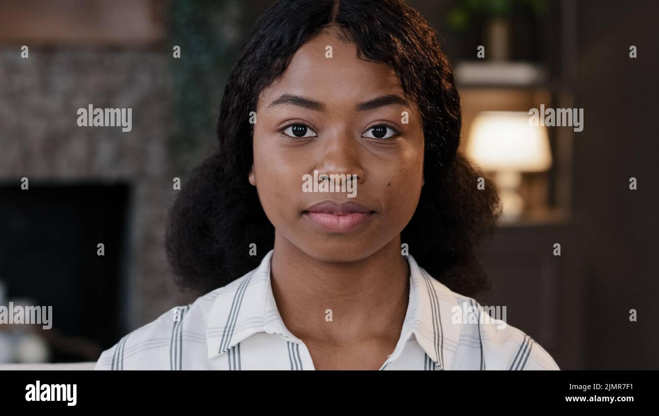 Close up female portrait indoors african 20s student girl 30s millennial woman wife girlfriend ...