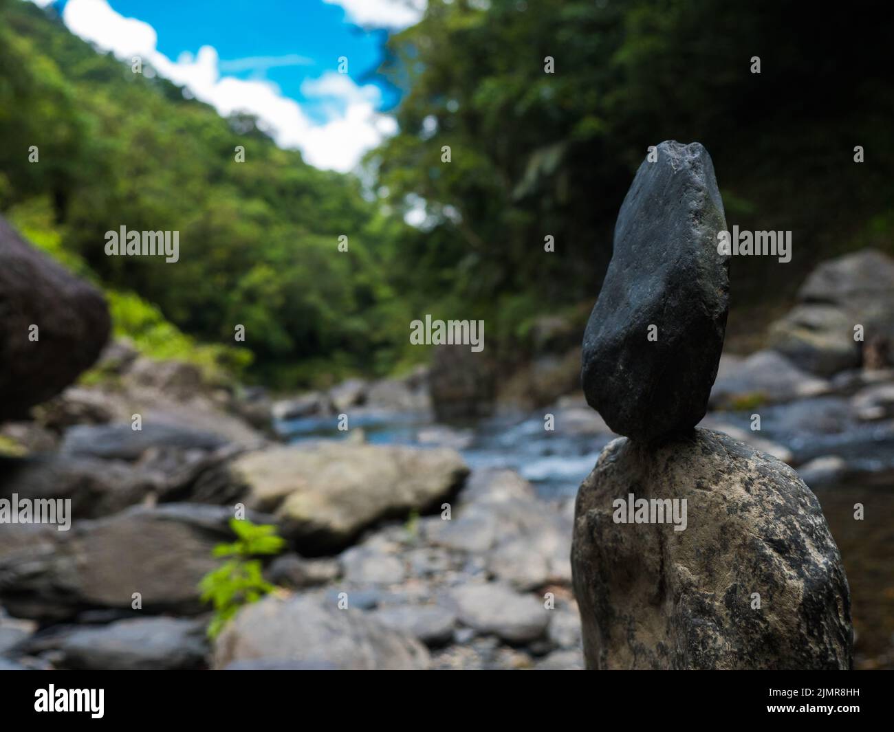 Small rock balanced as trail marker in Wulai, Taiwan Stock Photo - Alamy