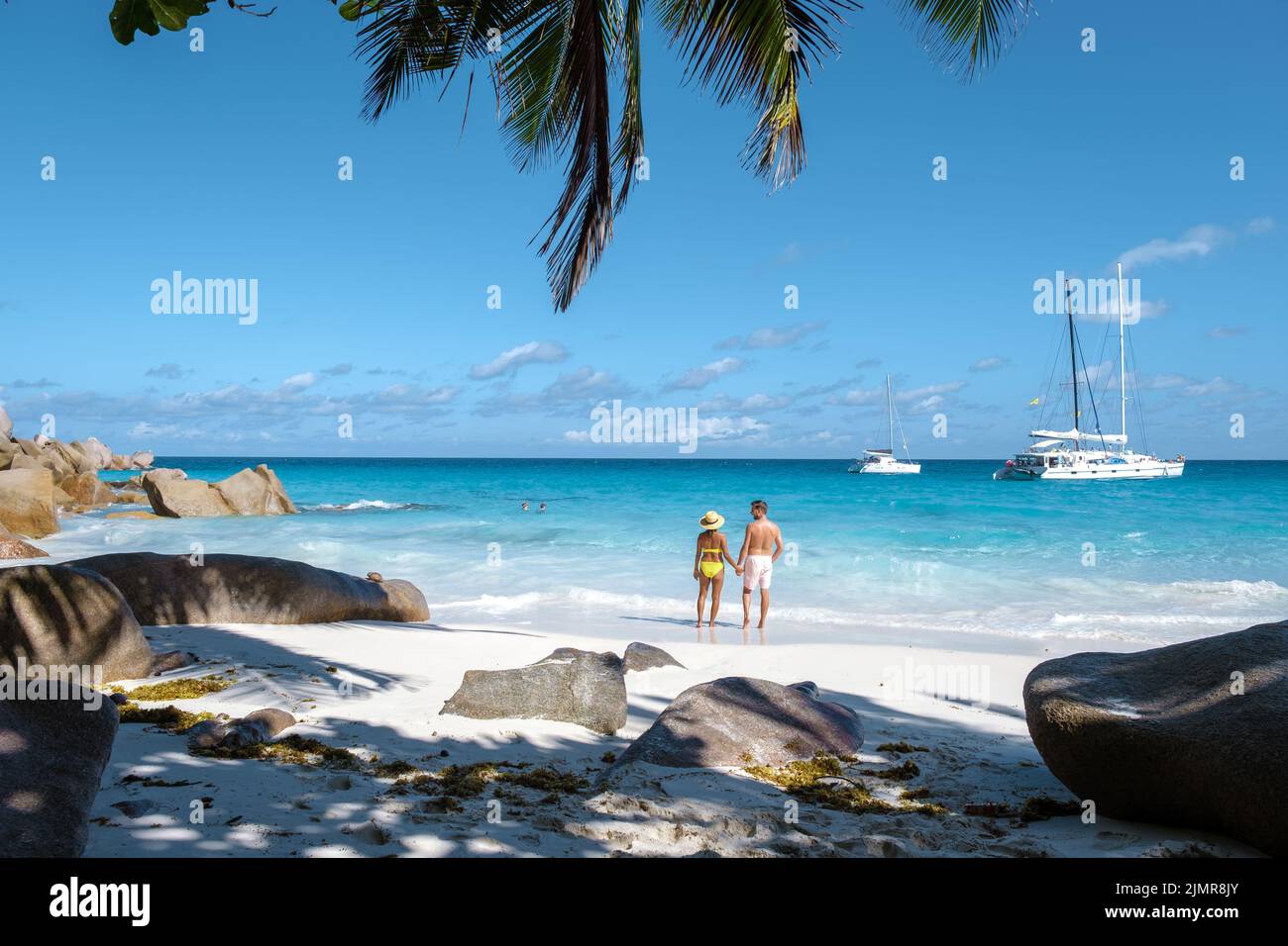 Anse Georgette Praslin Seychelles, young couple men and woman on a ...