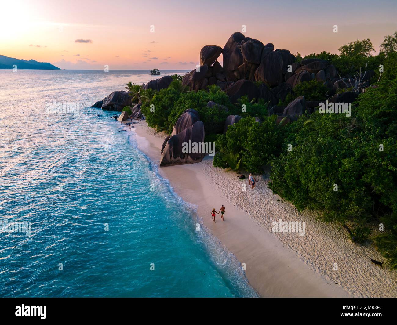 Anse Source d'Argent, La Digue Seychelles, young couple men and woman ...