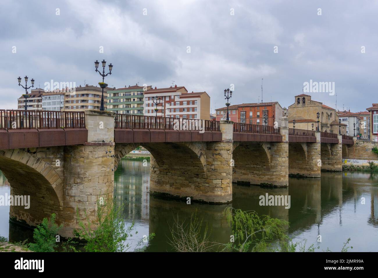 View of the stone bridge across the Ebro River and the historic city ...
