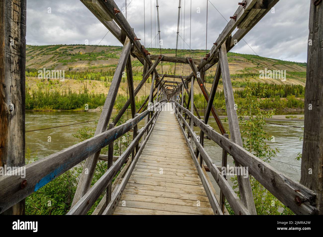 The wooden bridge across the Pelly River that carried the historic ...