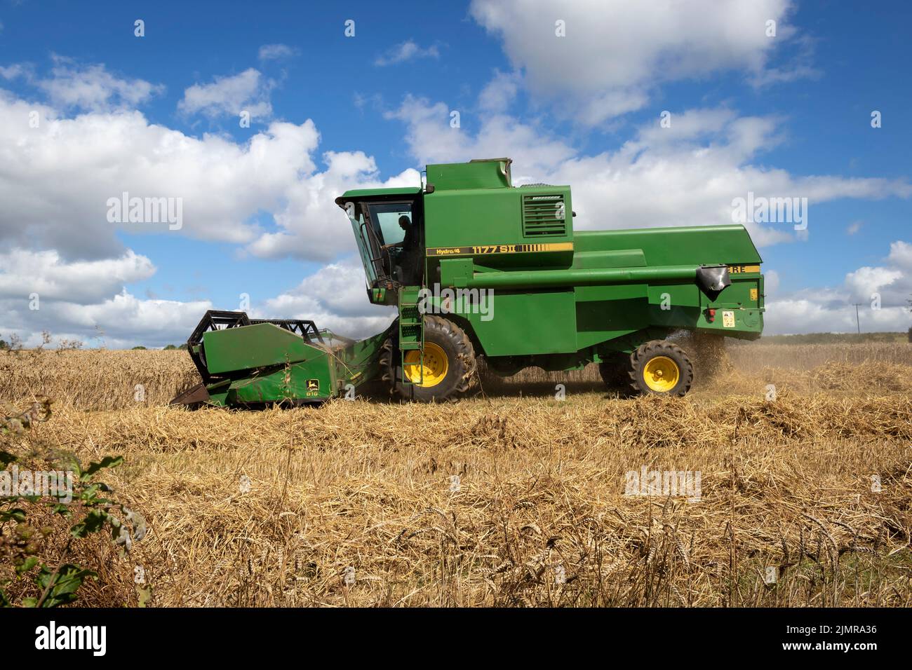 A John Deere 1177 combine harvester working on the fields in Stoke ...