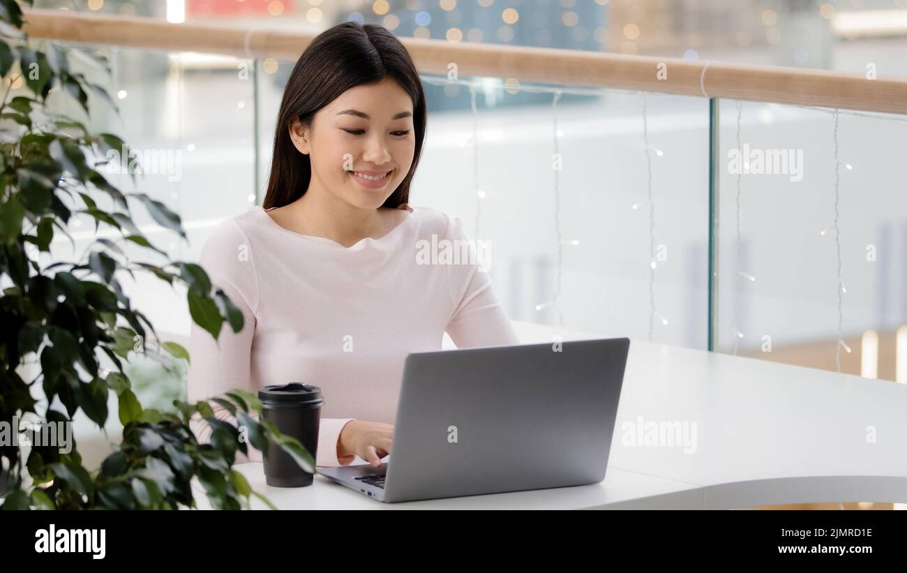 Asian girl student distant e-learning online education in cafe with ...