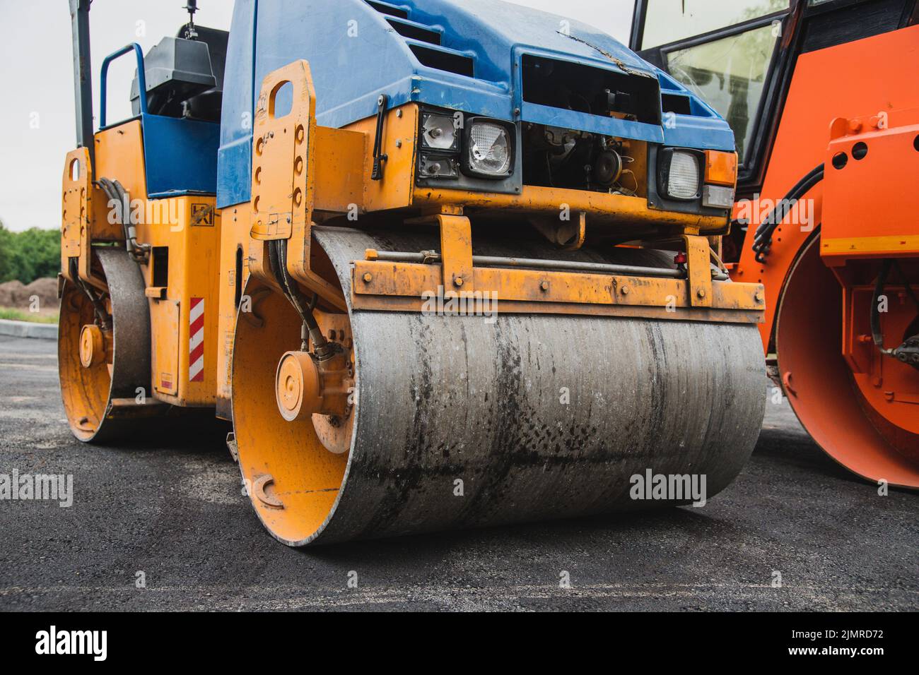 Old paver close-up. Road roller. Road construction concept Stock Photo ...
