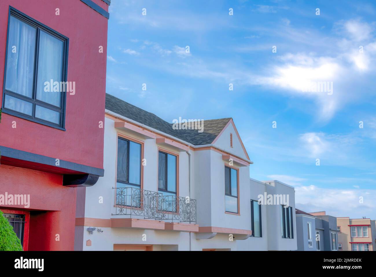 Row of houses with painted walls exterior against the sky in San ...
