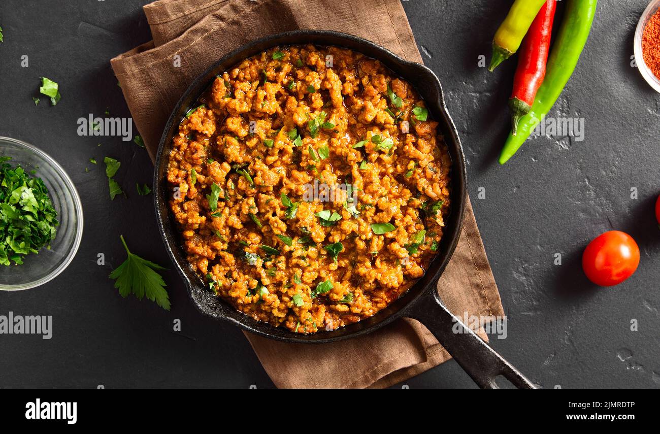 Keema curry in pan over black stone background. Indian and pakistani ...