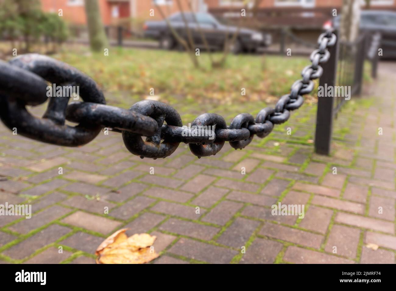 Selected focus on hanging metallic chain Stock Photo - Alamy