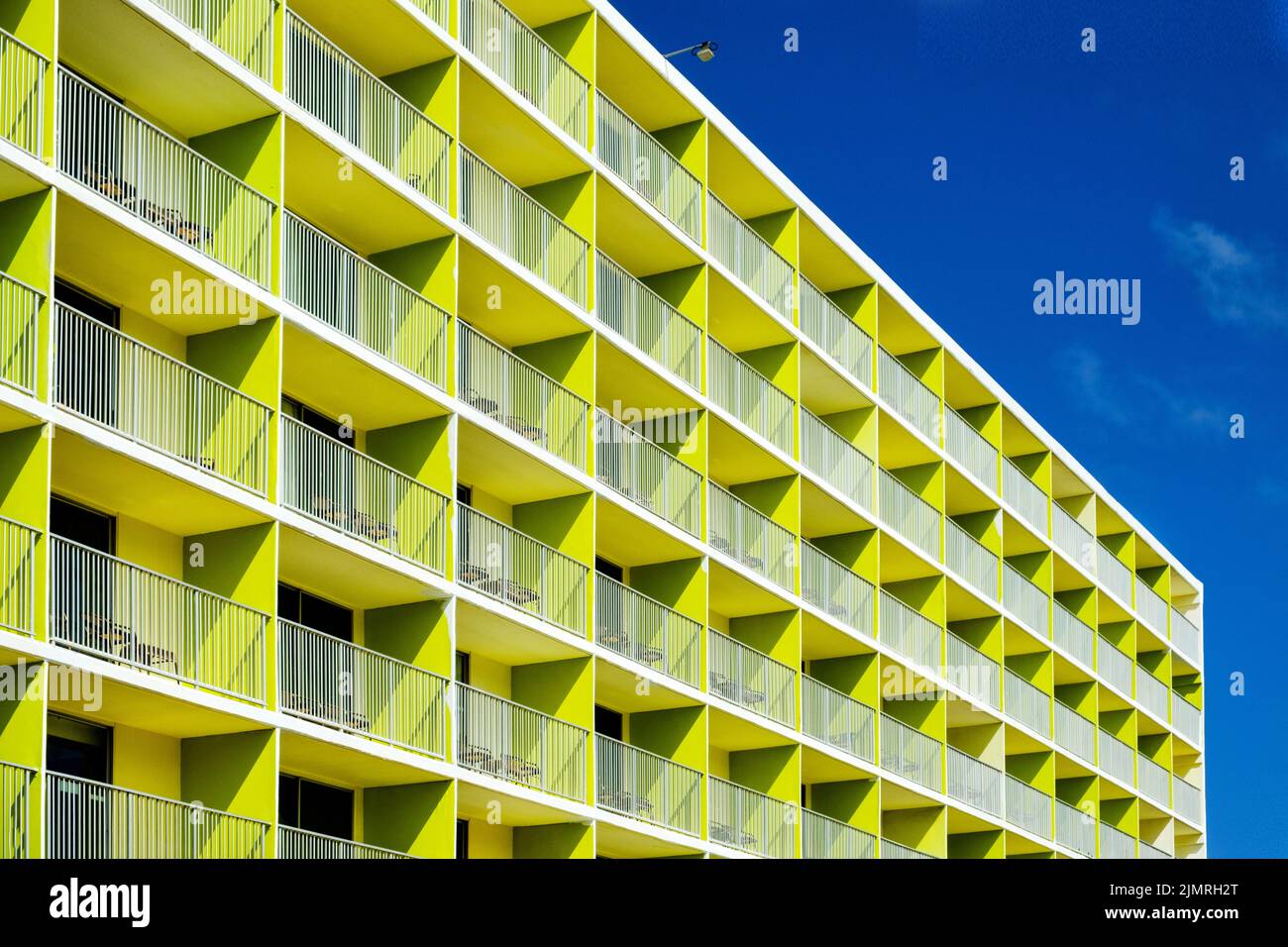 A modern apartment block painted in bold striking colours. The boxed ...