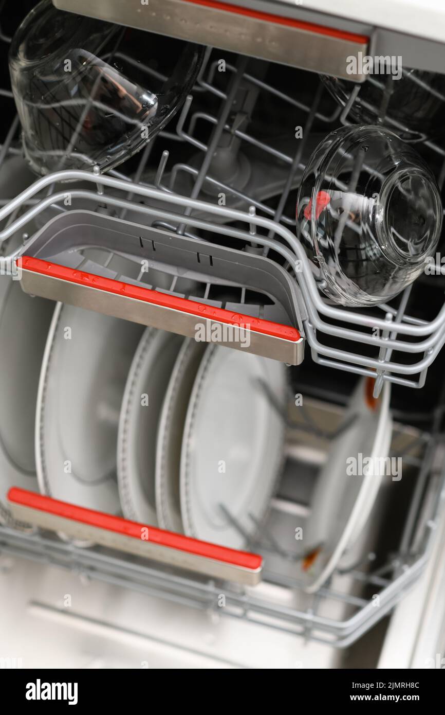 Clean dishes in the dishwasher close-up. Top view Stock Photo - Alamy