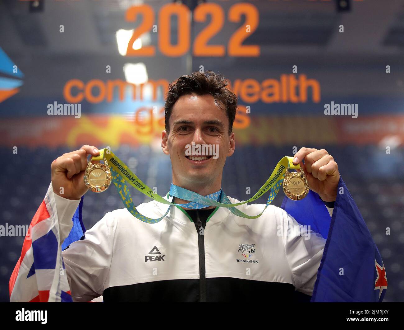 New Zealand's Paul Coll poses for photos after the Mixed Doubles gold ...