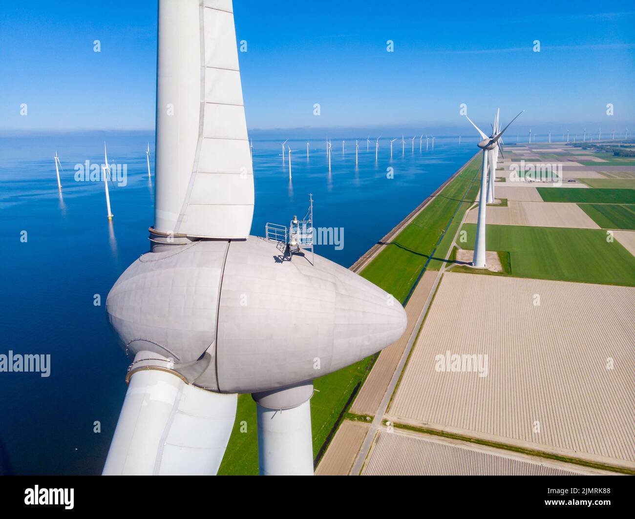 Huge windmill turbines, Offshore Windmill farm in the ocean ...