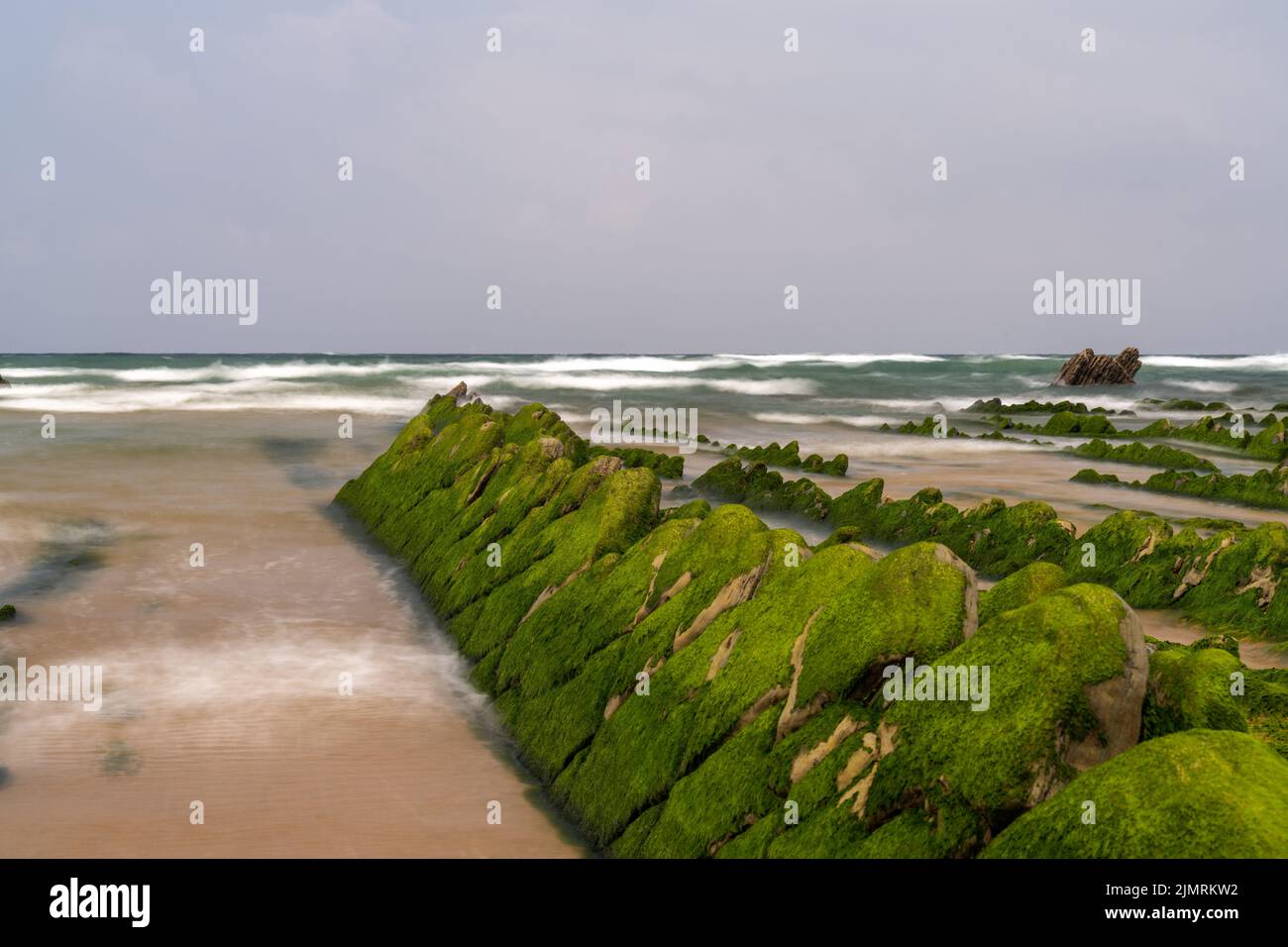 A long exposure view of Flysch rock formations at low tide at Barrika ...