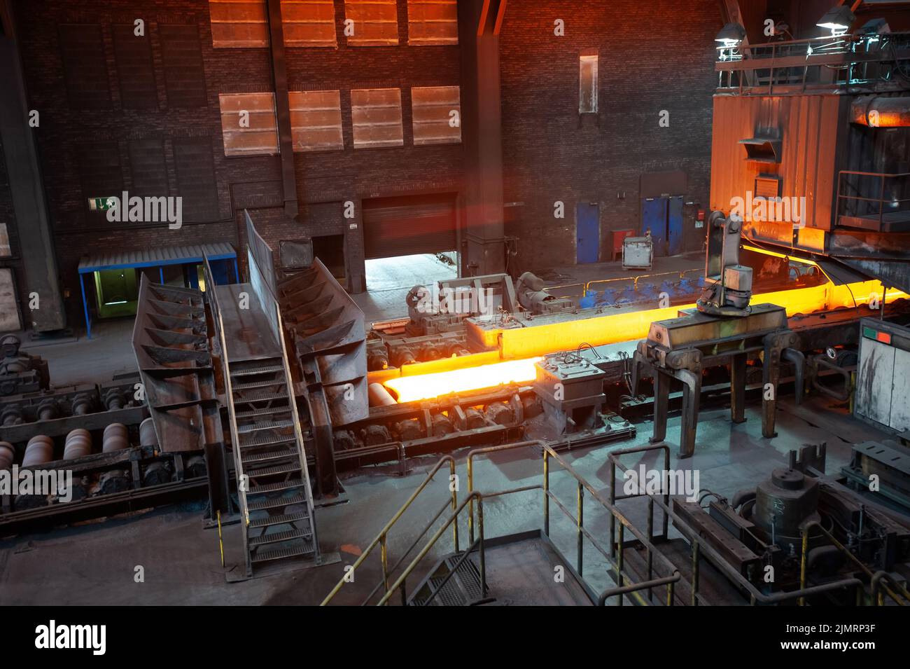 Metallurgical factory in Germany, hot rolled metal conveyor, sheet steel production Stock Photo ...